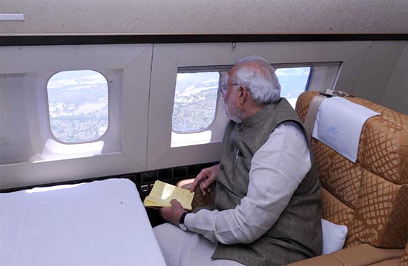 PM Modi undertakes aerial survey of Kashmir after floods kill 175 ...